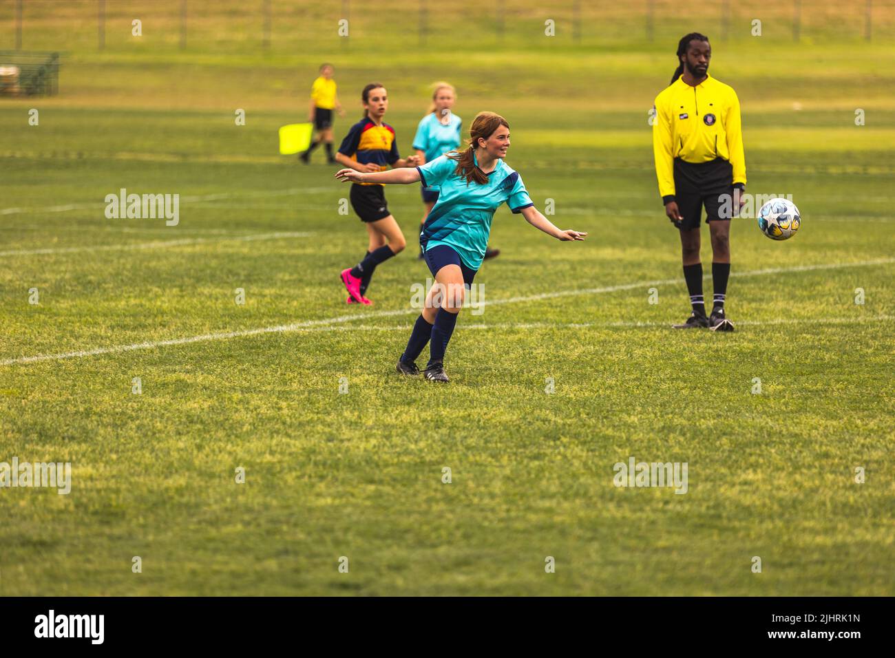 The young girls playing soccer at Youth Soccer Game Stock Photo - Alamy