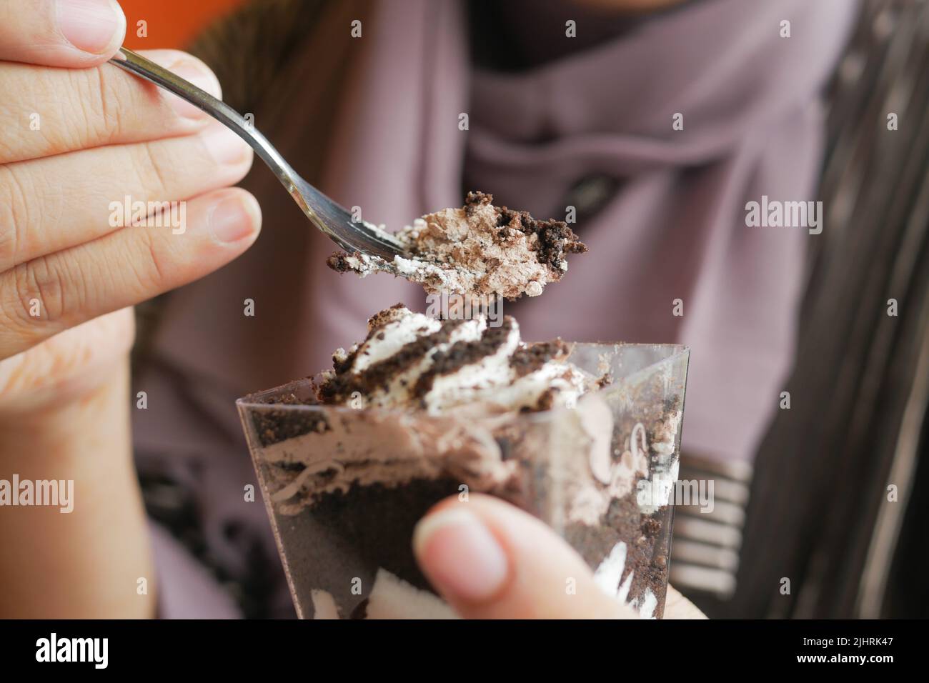 Hand spoon eating chocolate cake hi-res stock photography and images ...