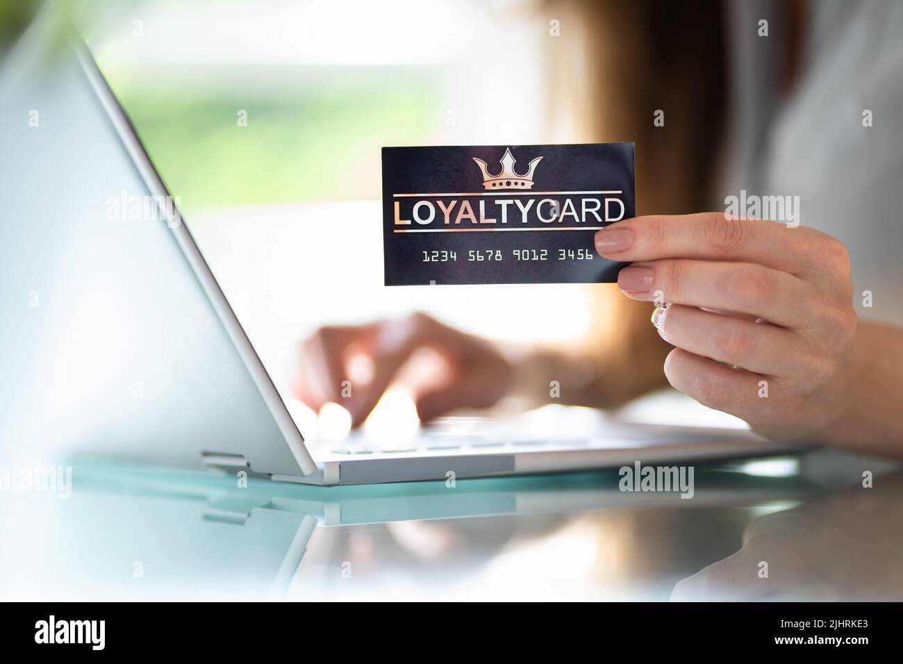 Hand Holding Loyalty Rewards Bonus Program Card Stock Photo - Alamy