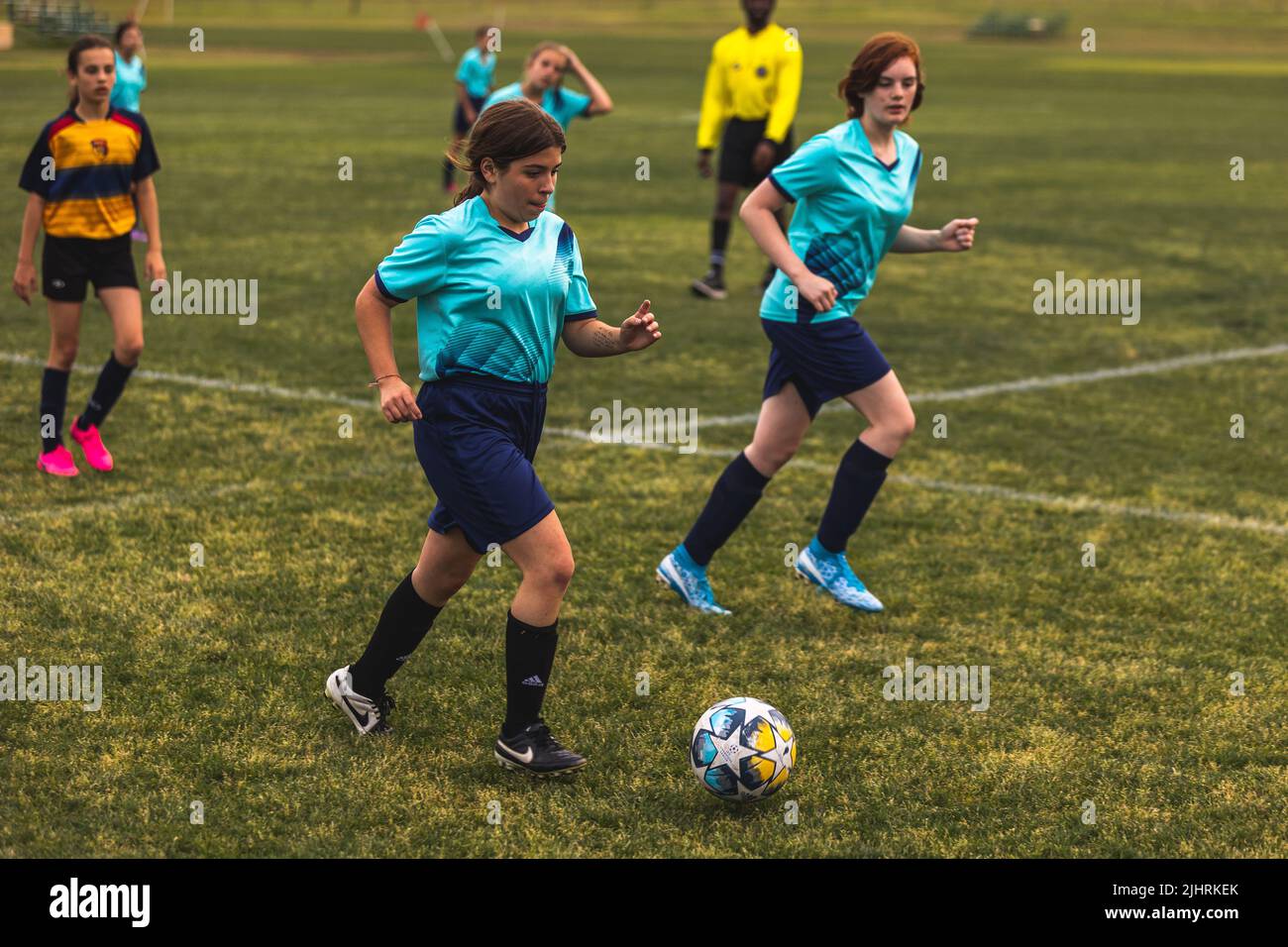The young girls playing soccer at Youth Soccer Game Stock Photo - Alamy