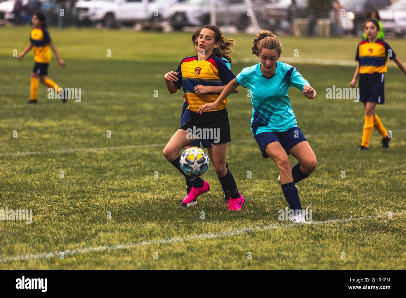 The young girls playing soccer at Youth Soccer Game Stock Photo - Alamy
