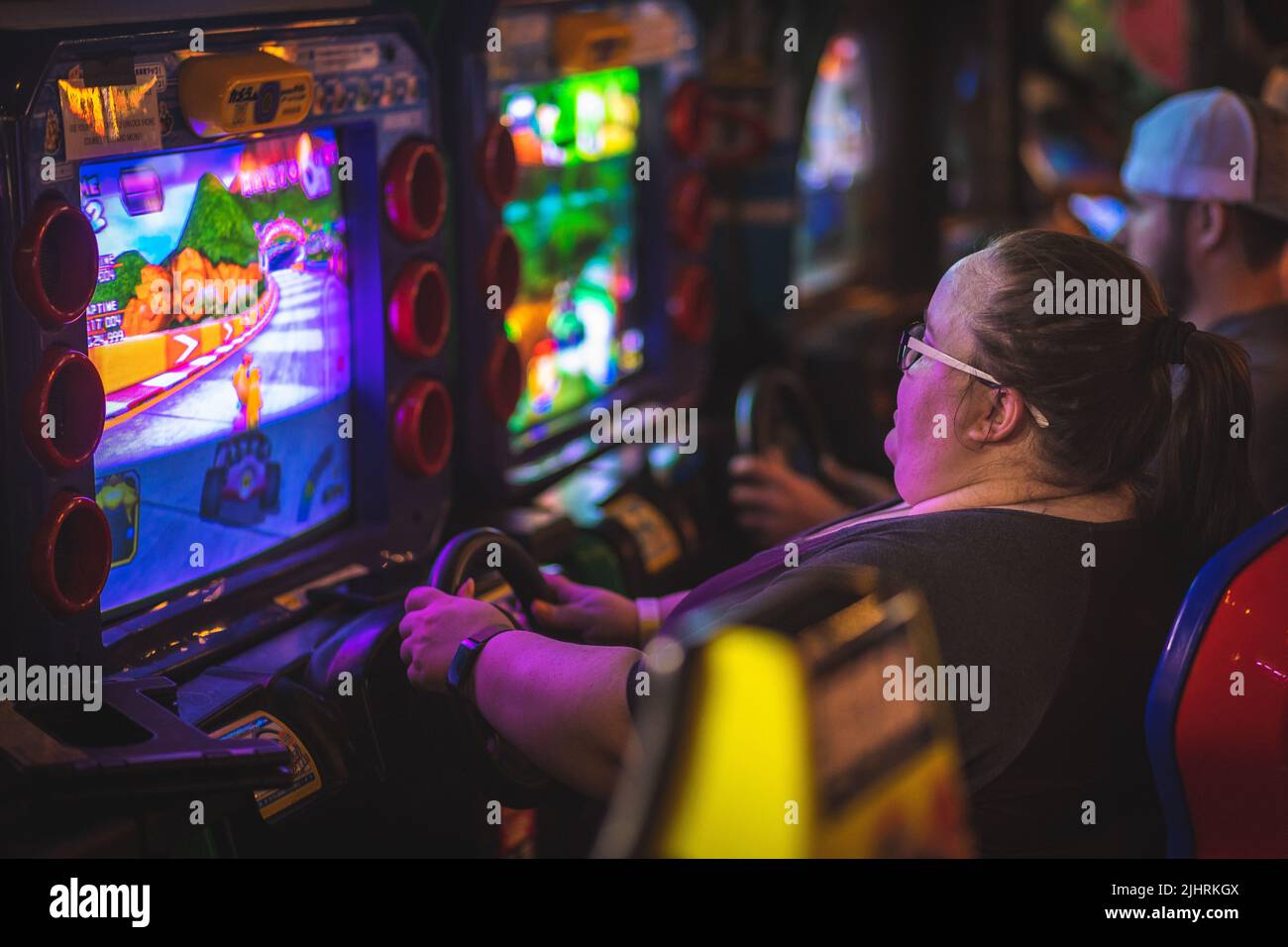 A woman enjoying the arcade game offered by Fort Worth's local arcade ...