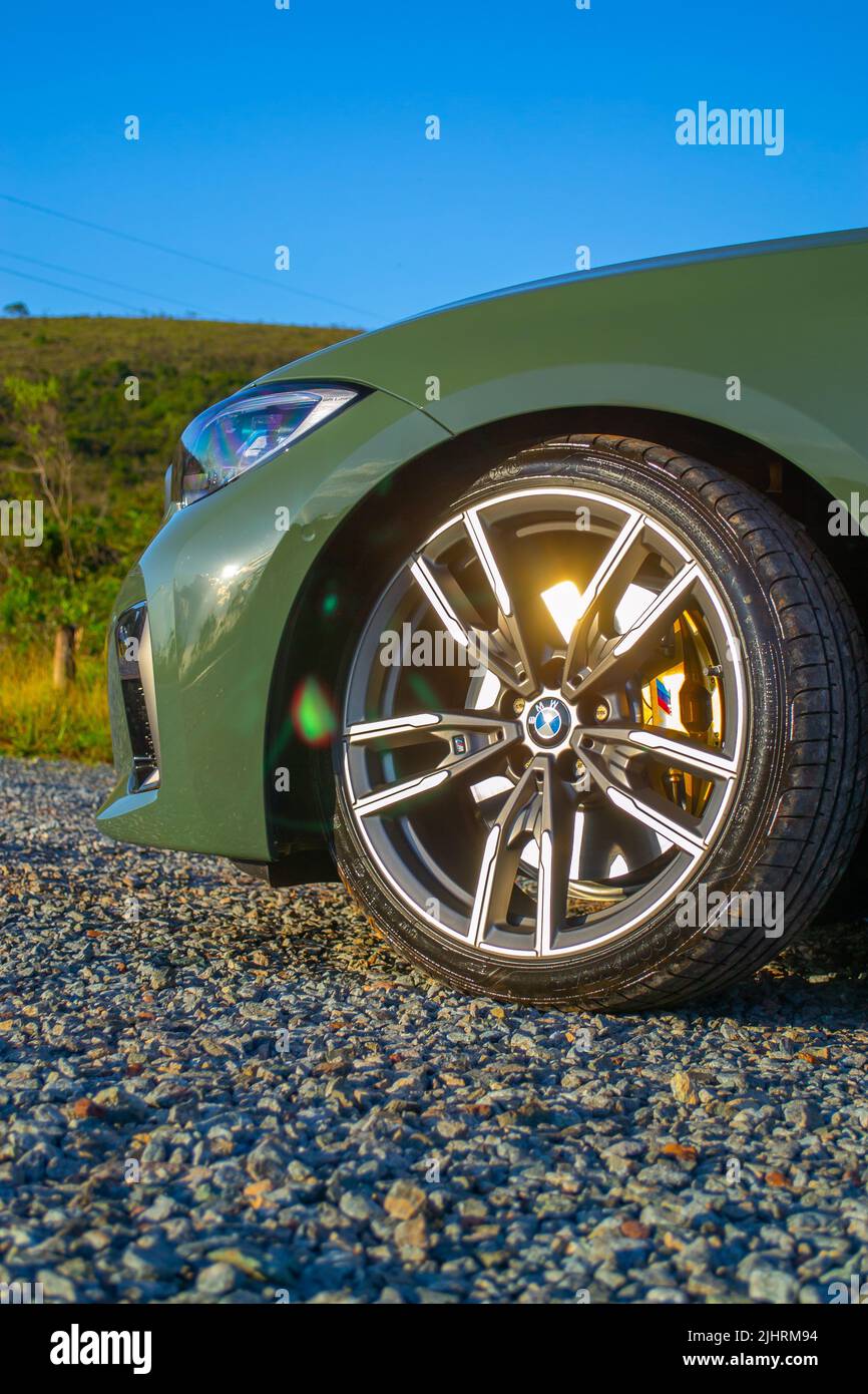 A vertical shot of a BMW M340i parked outside under the sunlight Stock ...
