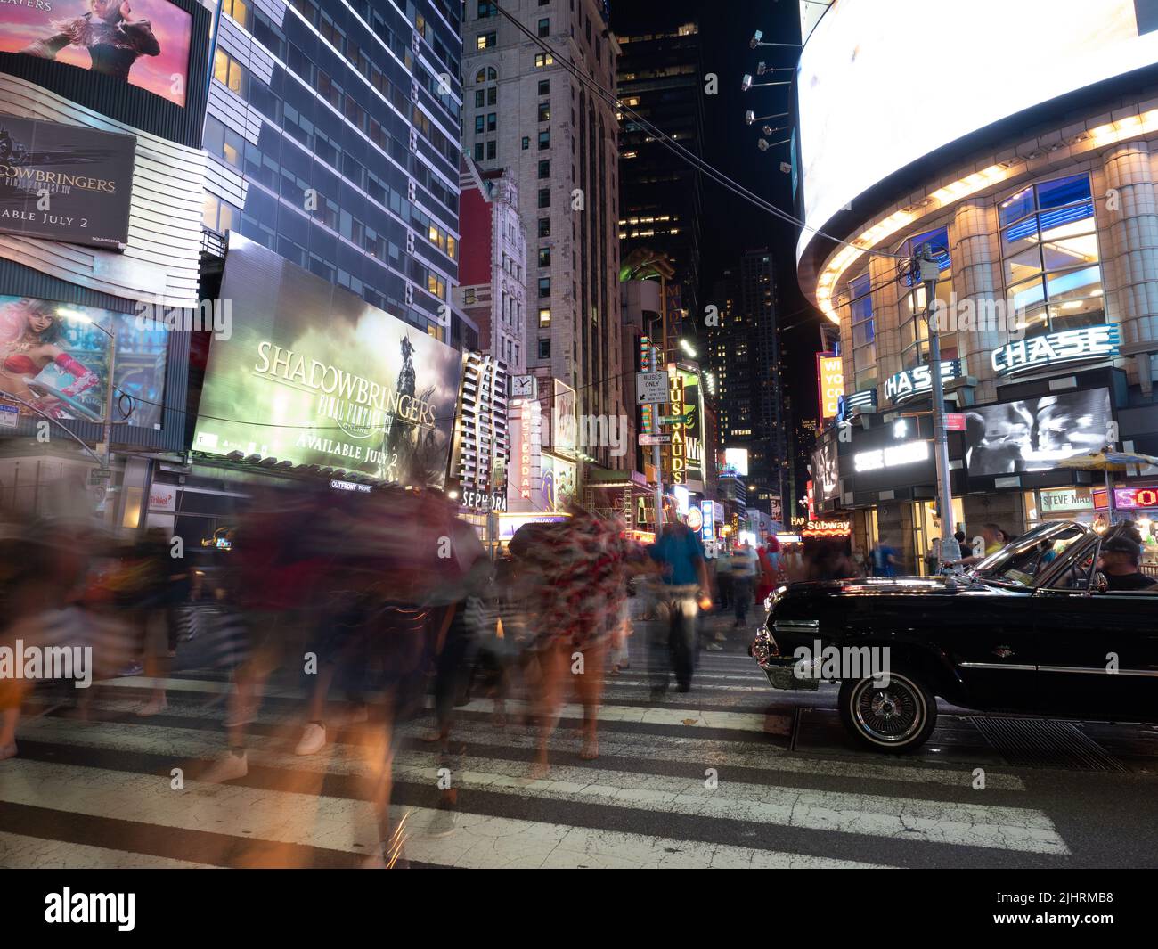 Long exposure image of a pedestrian crossing near Times Square Stock ...