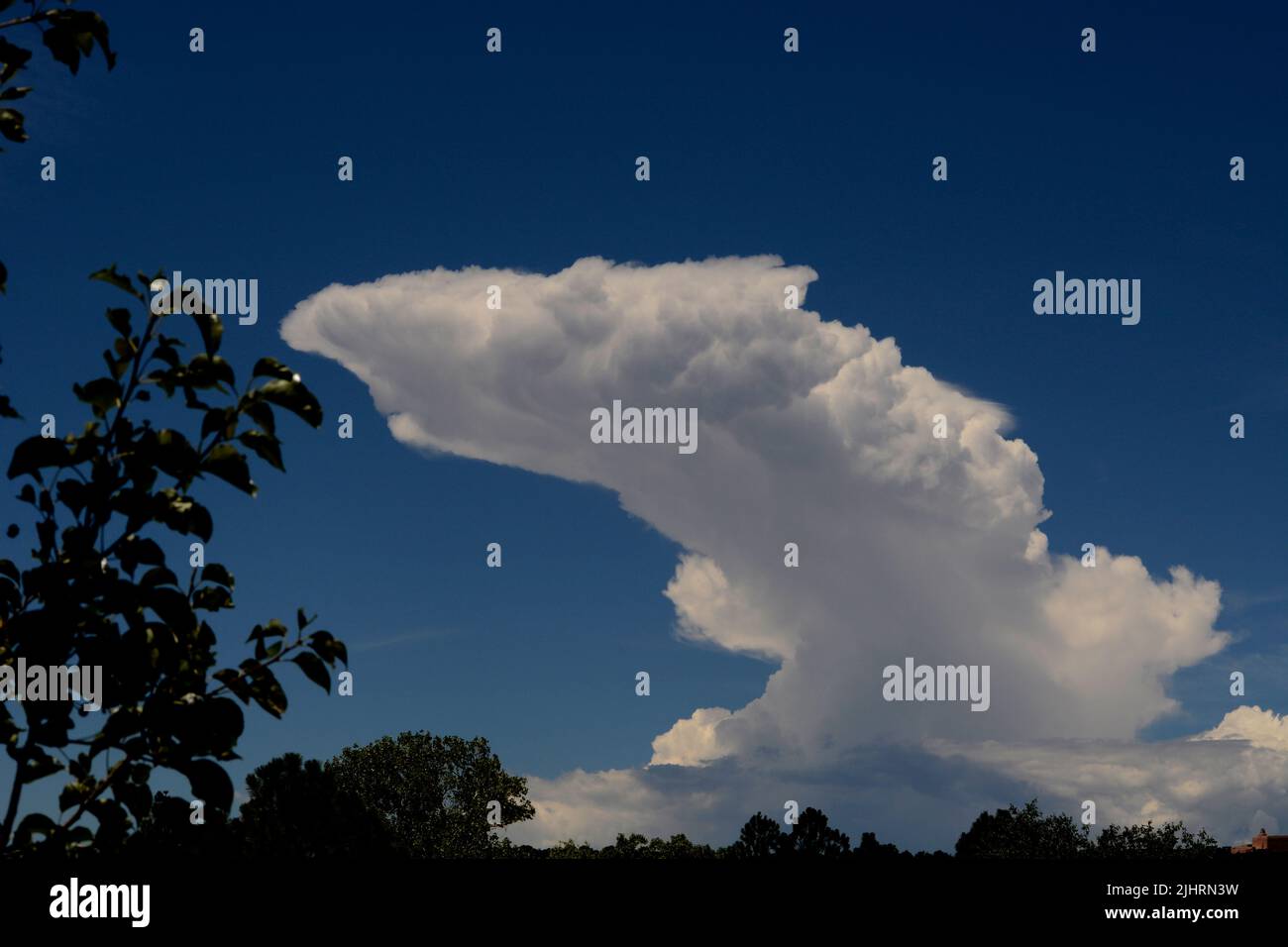 Cumulonimbus clouds form on the horizon in New Mexico near Santa Fe ...