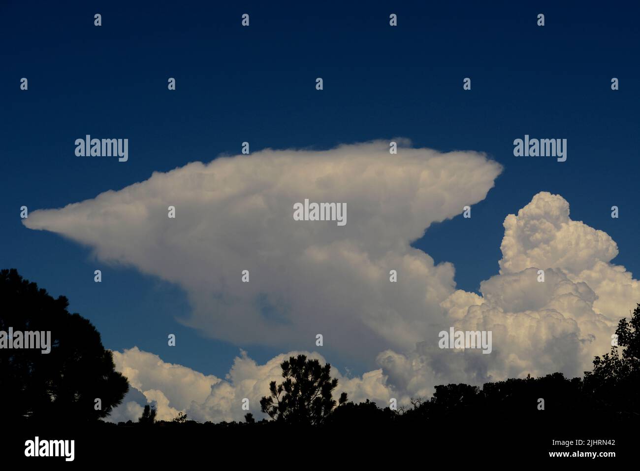 Cumulonimbus clouds form on the horizon in New Mexico near Santa Fe ...