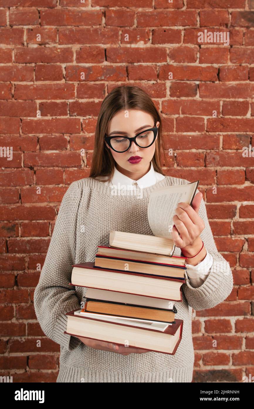 Beautiful girl reading textbook, free space Stock Photo - Alamy