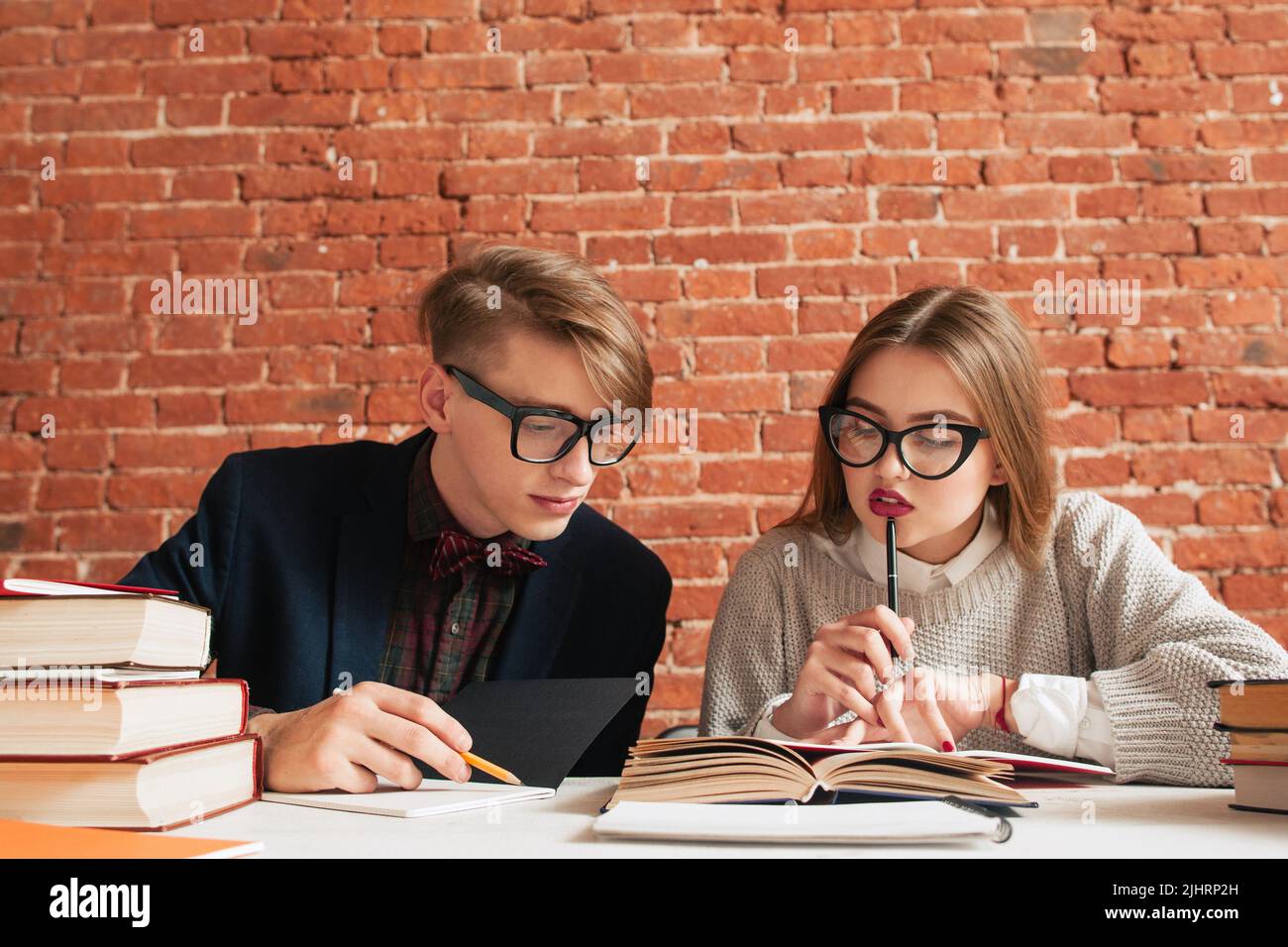 Excellent pupils carefully reading text free space Stock Photo - Alamy
