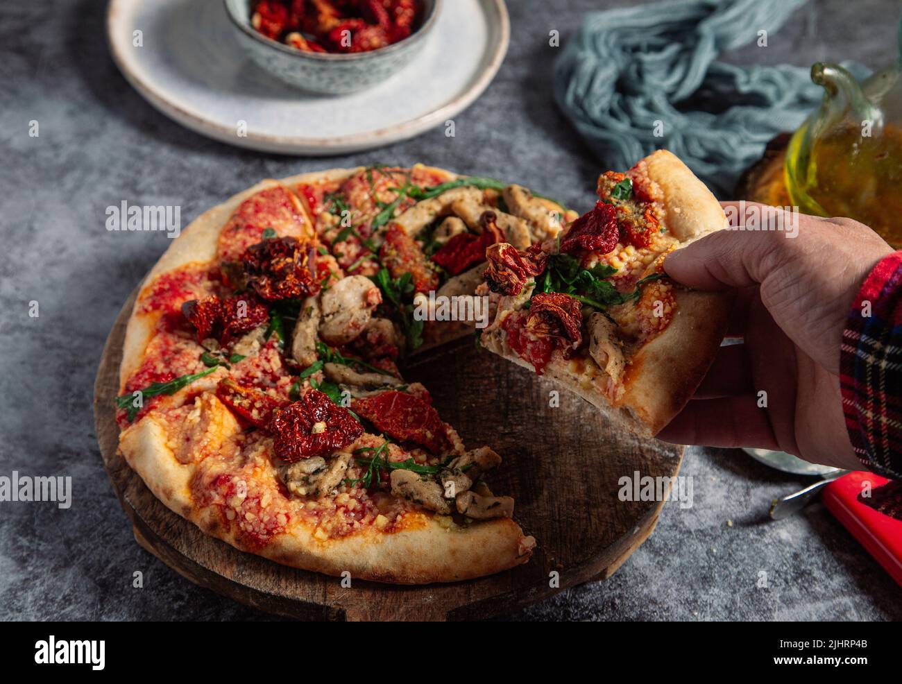 Hand holding pizza slice hi-res stock photography and images - Alamy