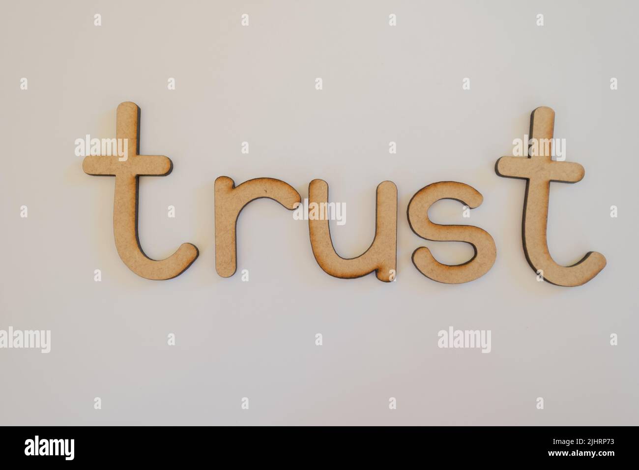 A word Trust made with wooden letters Stock Photo - Alamy