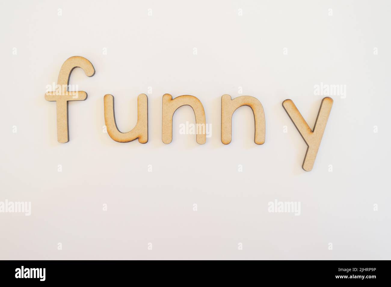 A word Funny made with wooden letters Stock Photo - Alamy