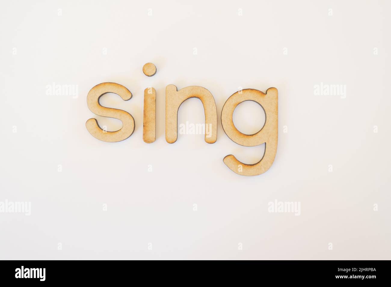 A word Sing made with wooden letters Stock Photo - Alamy