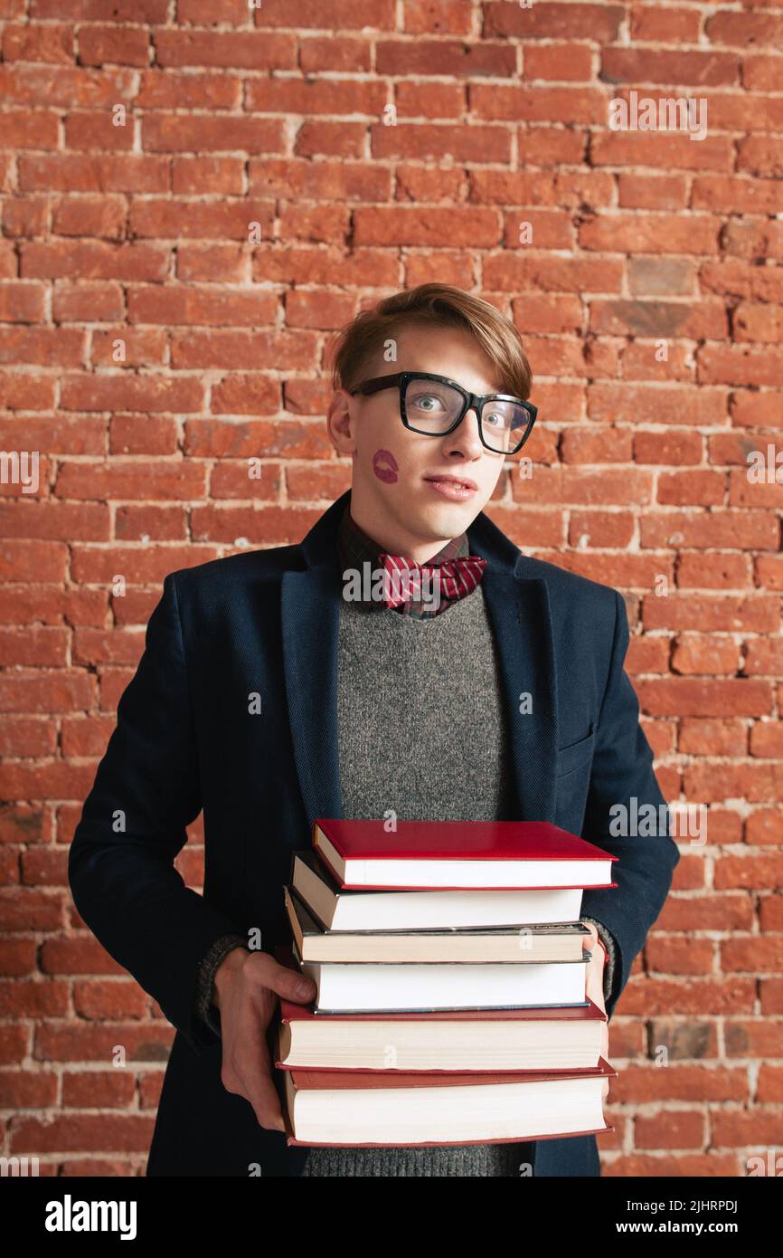 Excited student with kiss trace on cheek Stock Photo - Alamy
