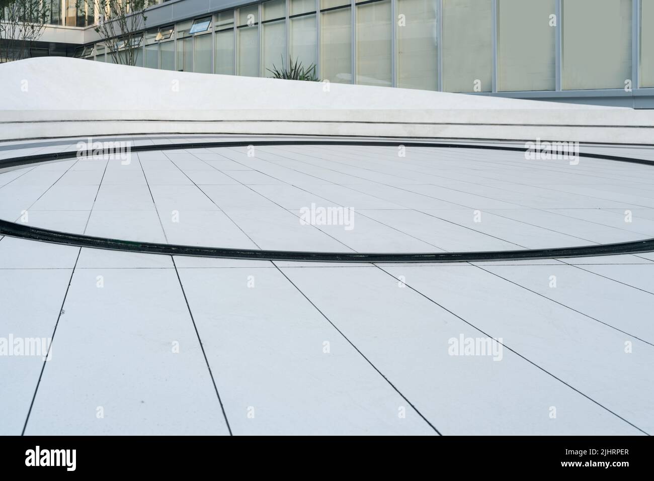 A top view of white empty ground floor in front of modern office ...
