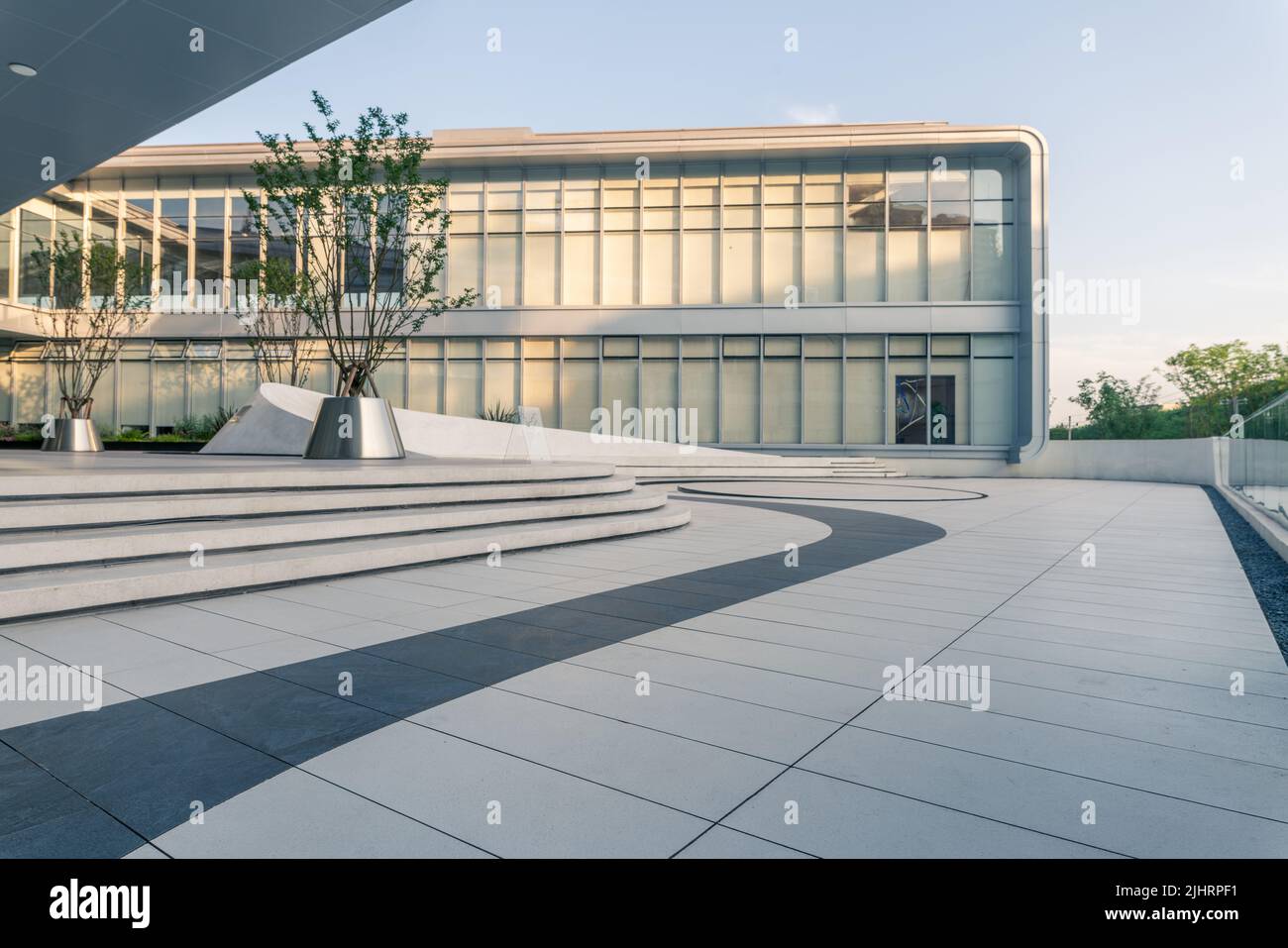 The white empty ground floor in front of modern office building ...