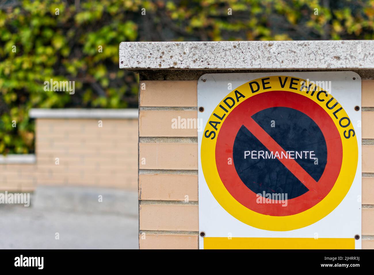 Sign in a garage. Translation, vehicle departure Permanent. Forbidden ...