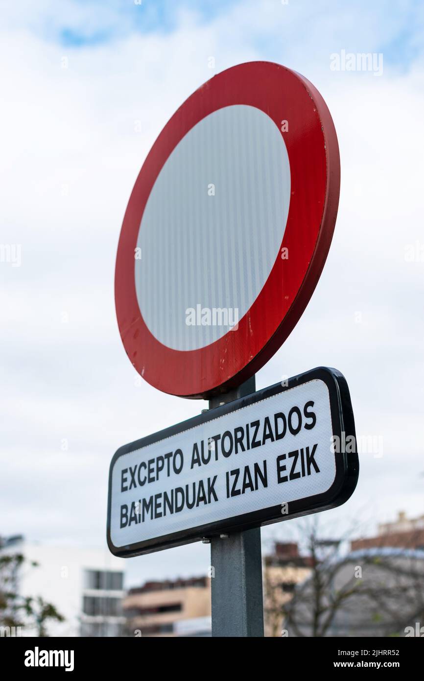 Prohibited passage sign with text in two languages. Translation, except ...