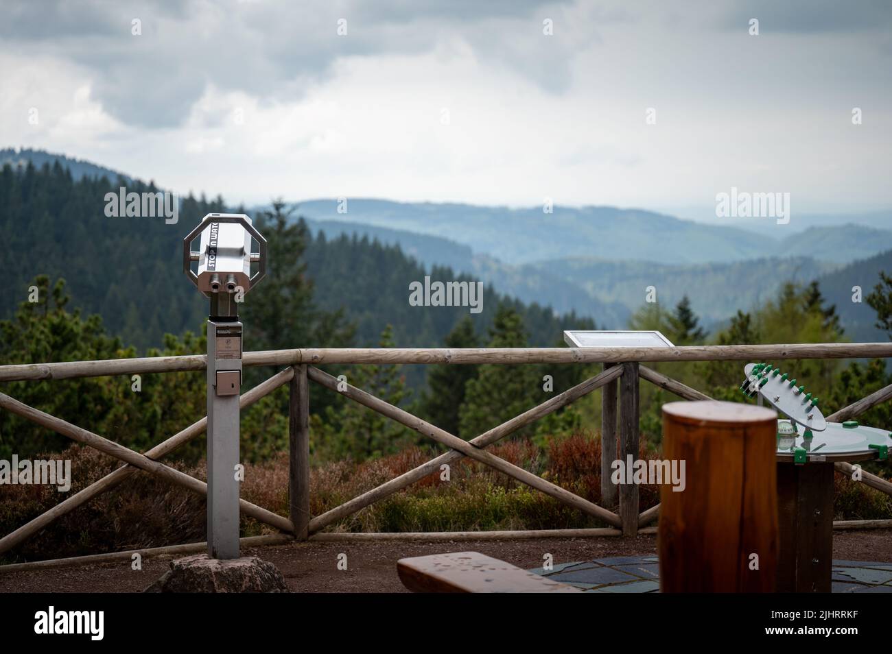 Wooden observation deck above the cliff overlooking the slopes of ...