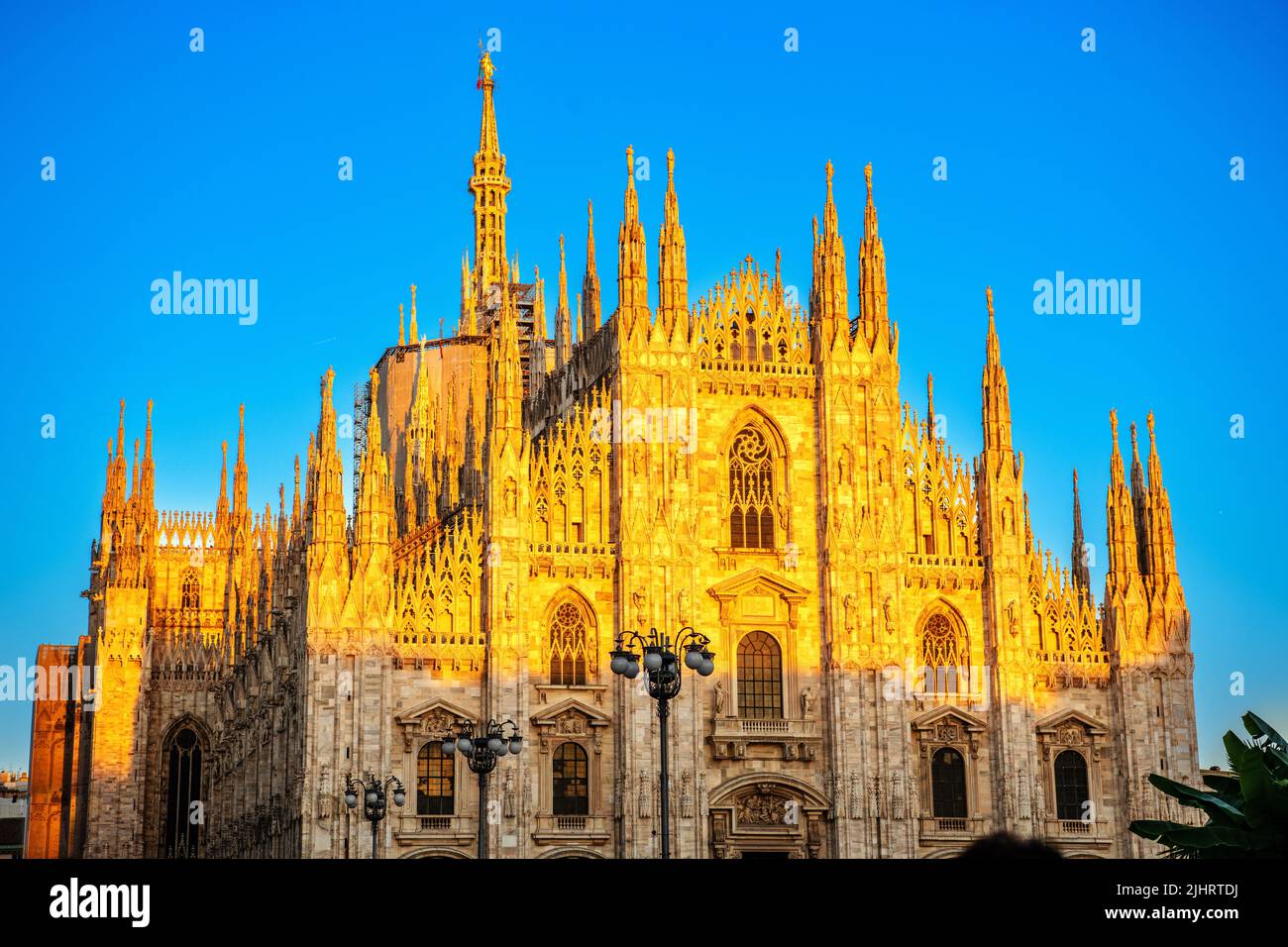 The mesmerizing view of Milan Cathedral during sunset Stock Photo - Alamy