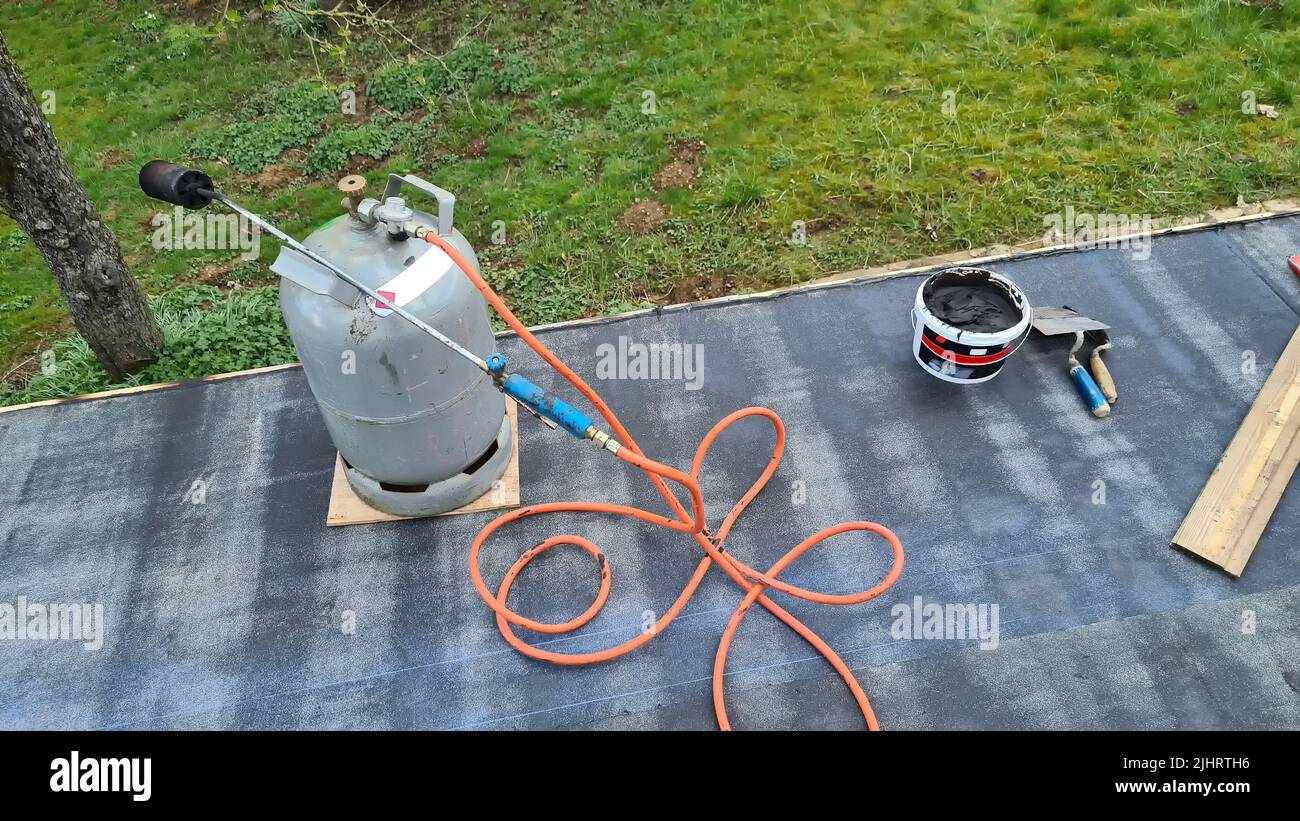 Roofing felt welding on bitumen roof roof repair with roofing felt and ...