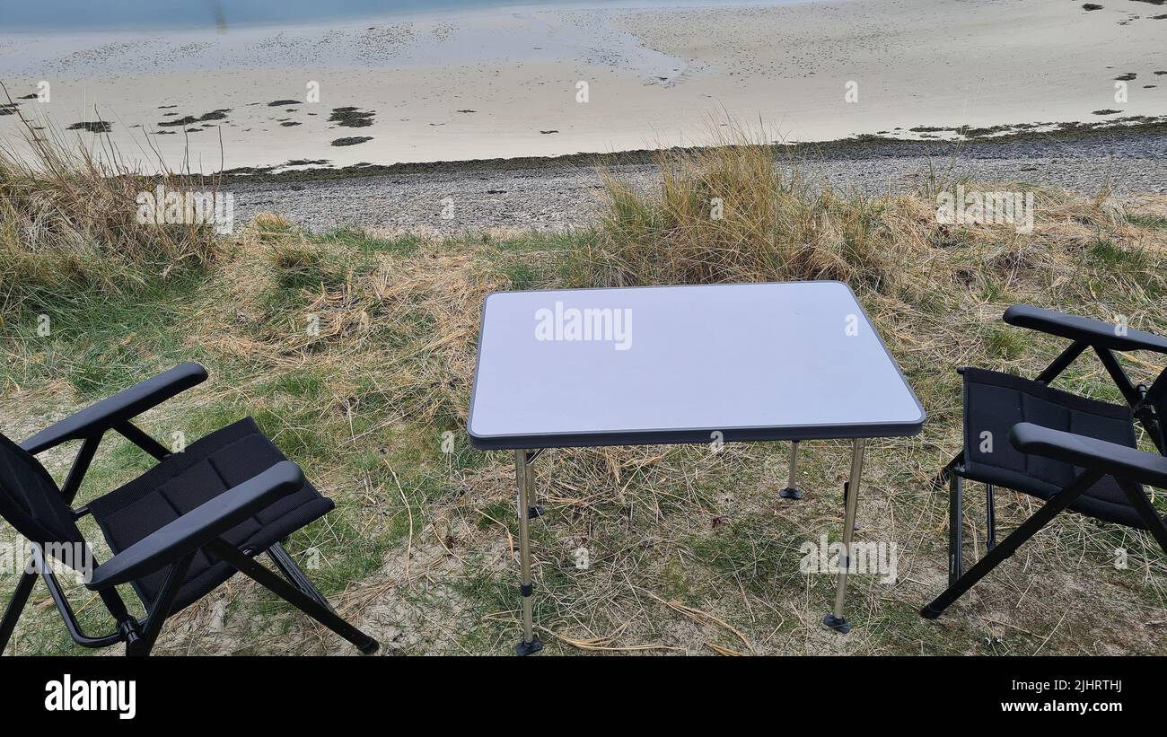 Dining table or camping table with chairs at the campsite Stock Photo ...