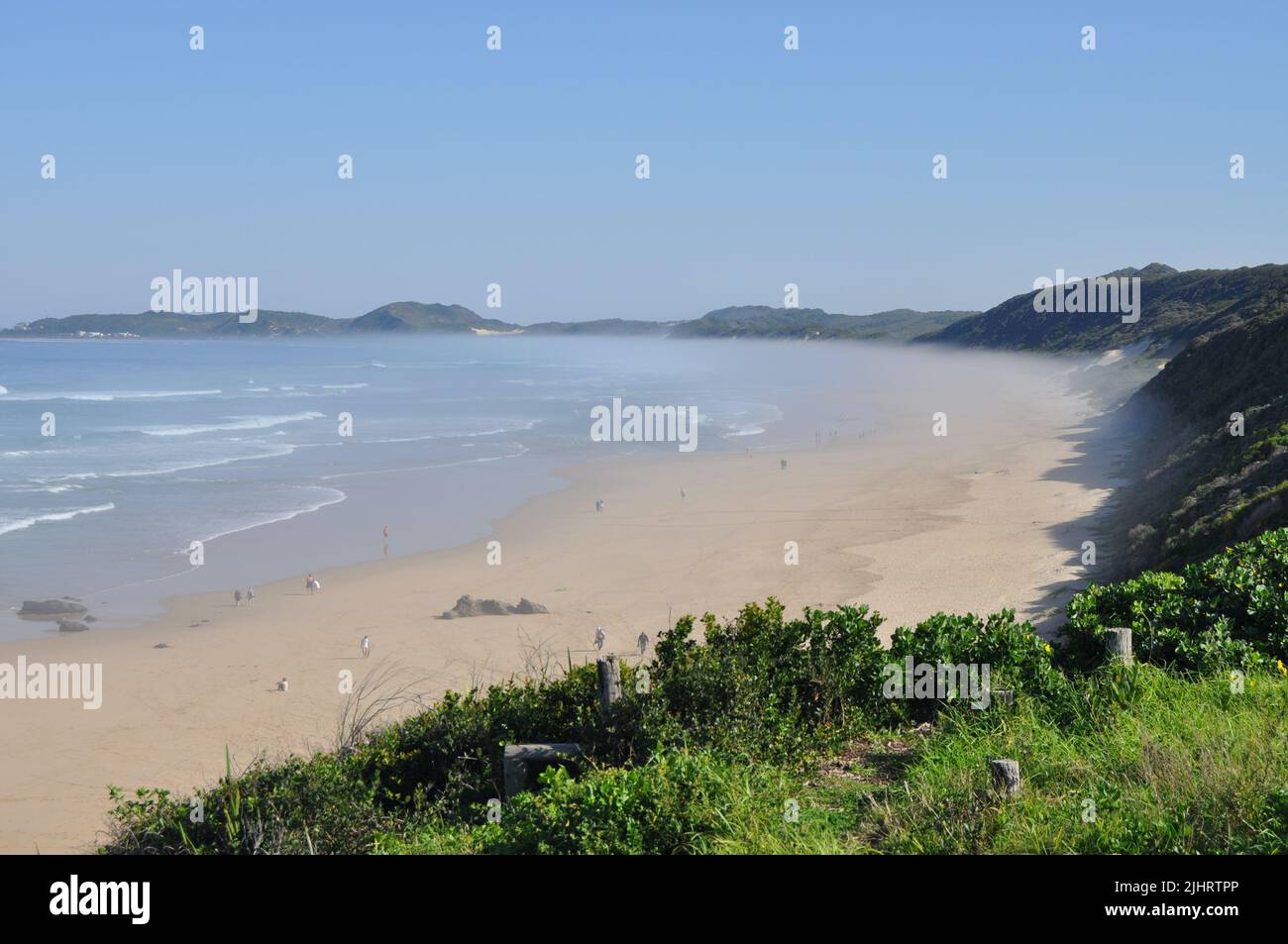 Sunny misty beach scene in Africa Stock Photo - Alamy