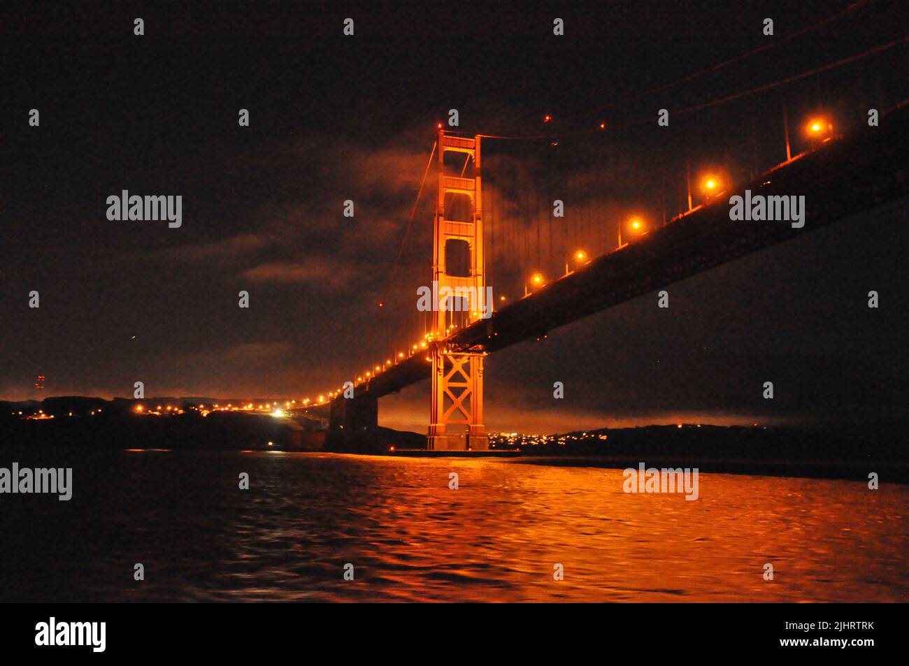 Golden Gate Bridge at night from below Stock Photo - Alamy