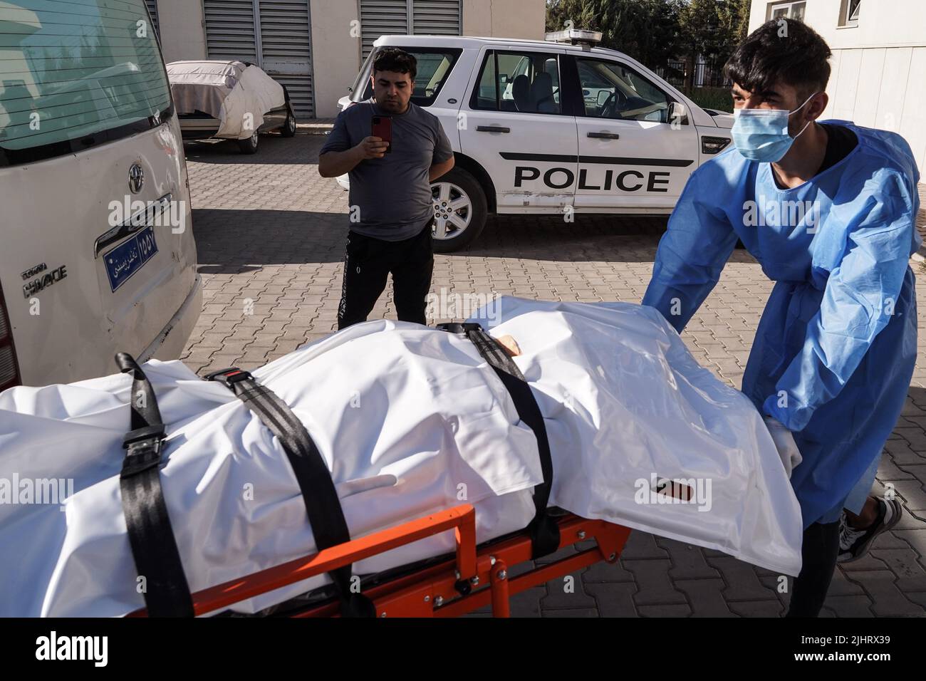 Zakho, Iraq. 20th July, 2022. A medic transports the body of a victim ...
