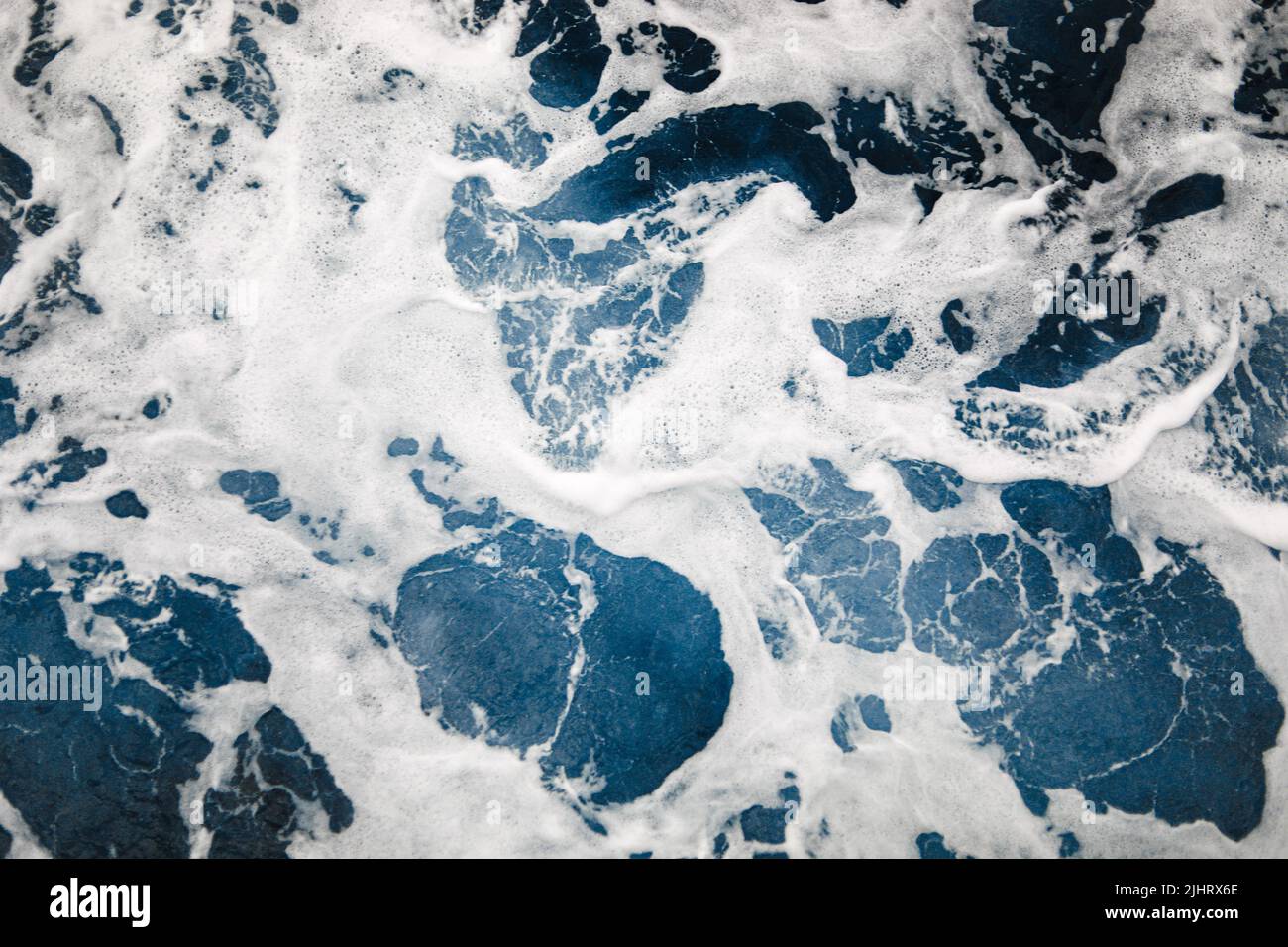 A top view of deep blue sea waves with foam - Perfect for desktop ...