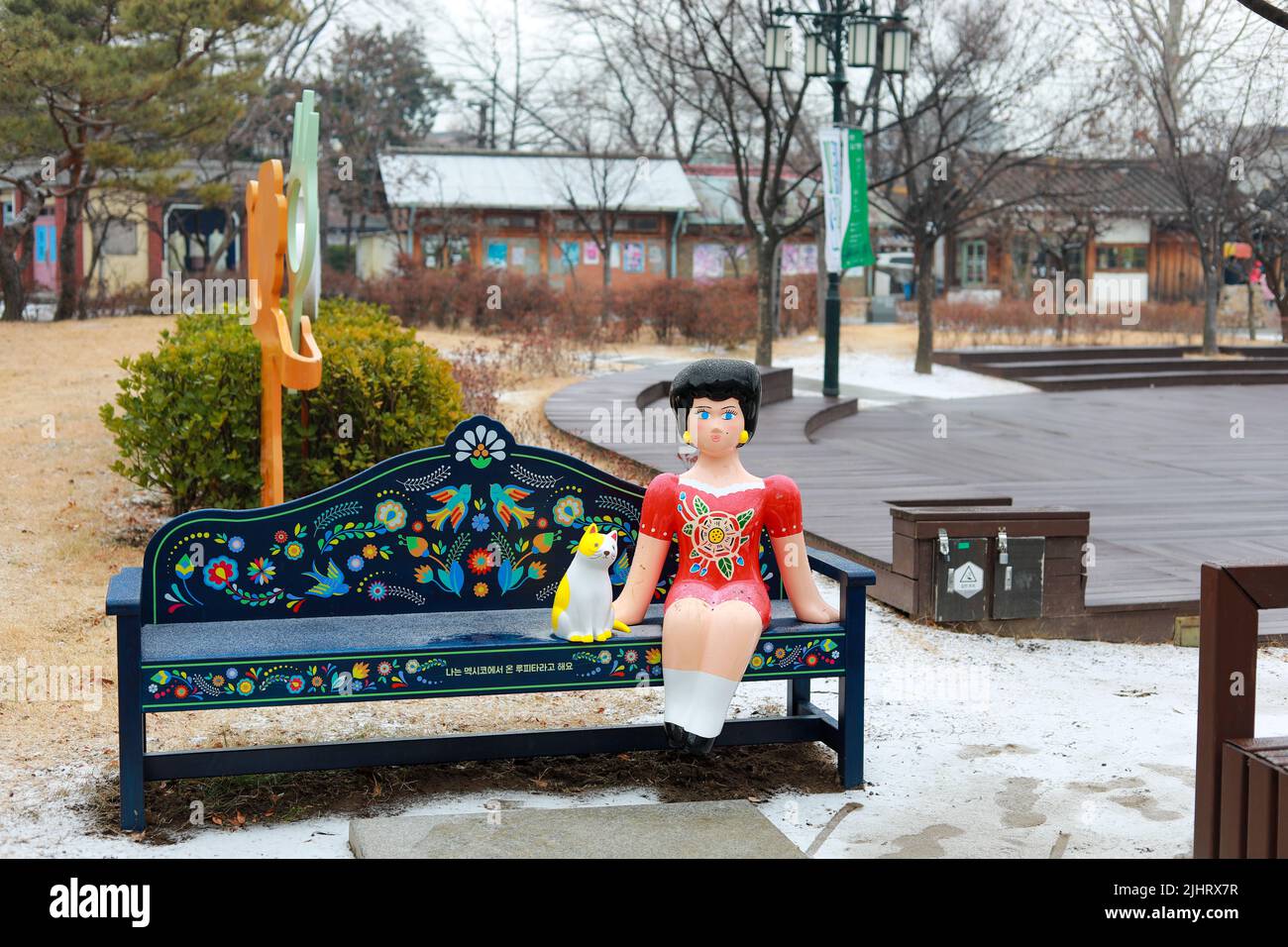 A preserved traditional Korean village with bench and doll decoration ...