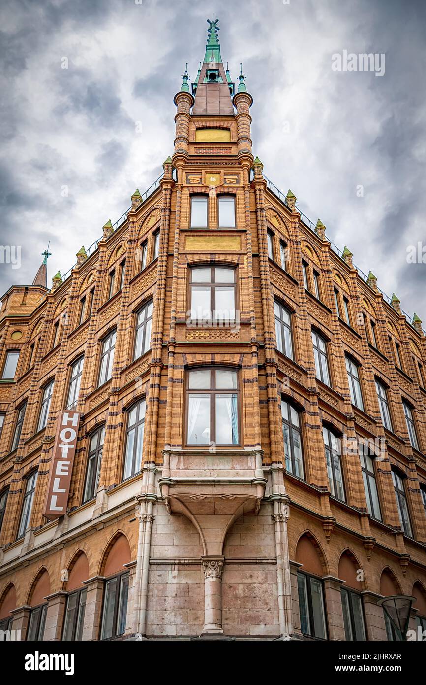 A vertical low angle shot of a beautiful exterior of a hotel in Malmo ...