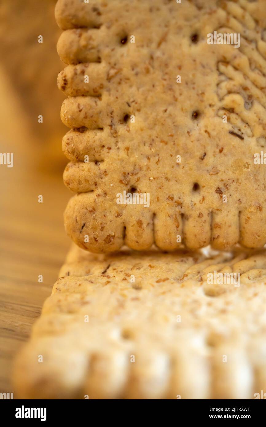 A soft focus of branded butter biscuits with arched edges Stock Photo ...