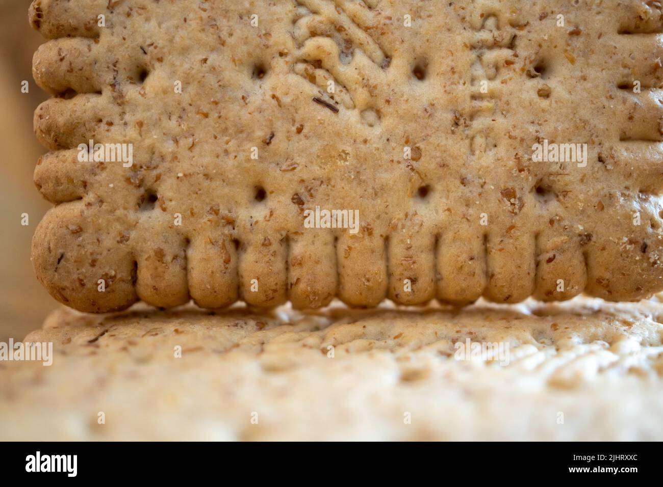 A soft focus of branded butter biscuits with arched edges Stock Photo ...