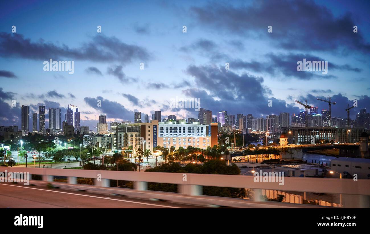 Morning light on Miami, Florida with skyline and bridge at blue hour ...
