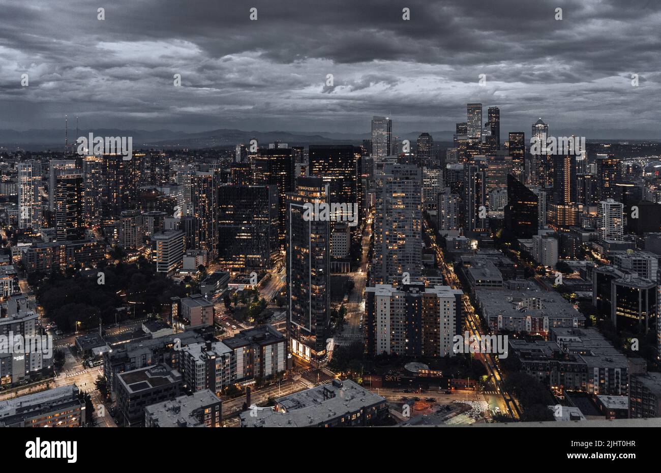 An aerial view of Seattle city with modern skyscrapers at night in ...