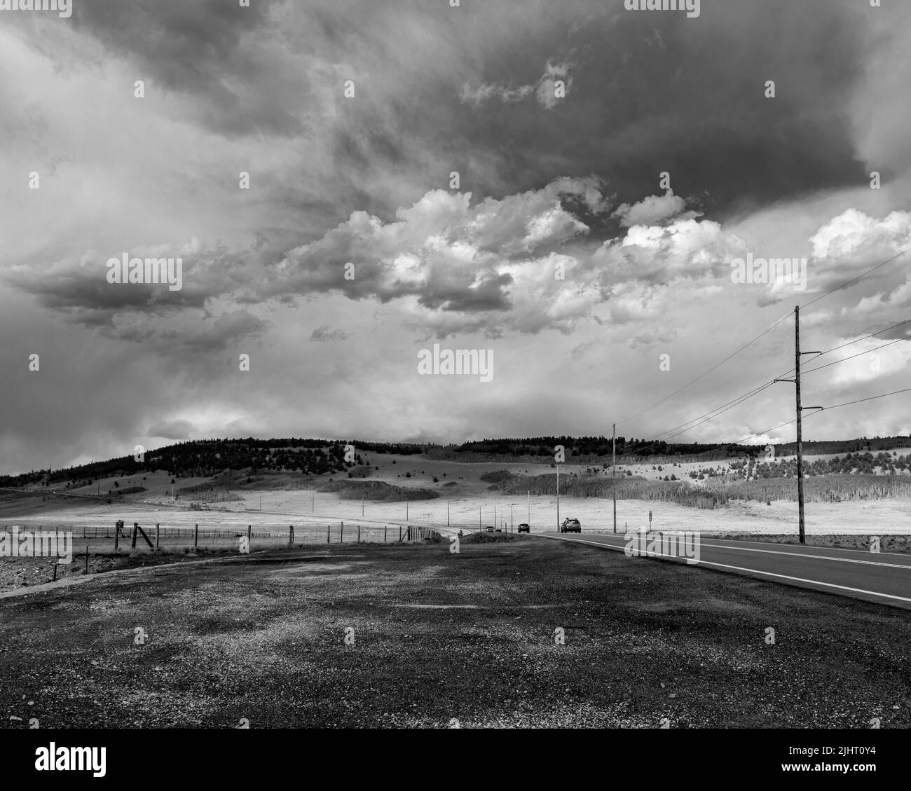 A grayscale of a field with hills in the background in Colorado Stock ...