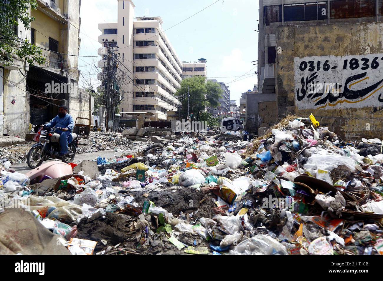 View of huge heap of garbage litter down behind Sindh Secretariat ...