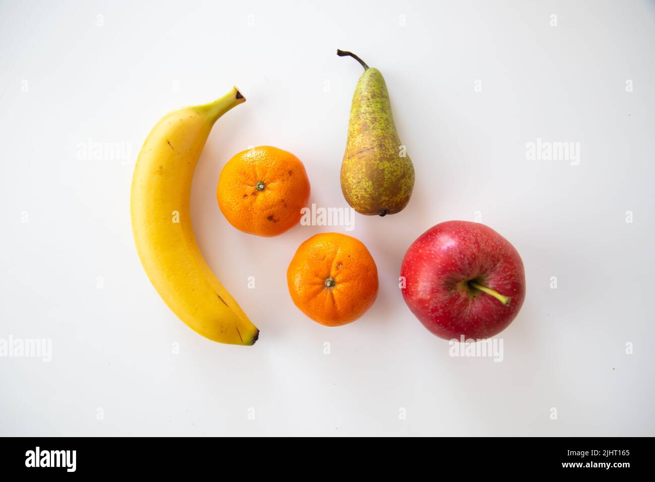 A top view of fresh fruits on a white background Stock Photo - Alamy