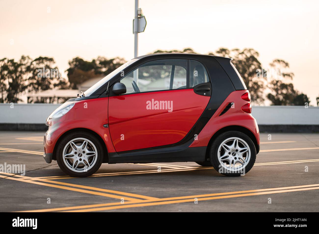 The sideview of red smart fortwo car in the parking Stock Photo - Alamy