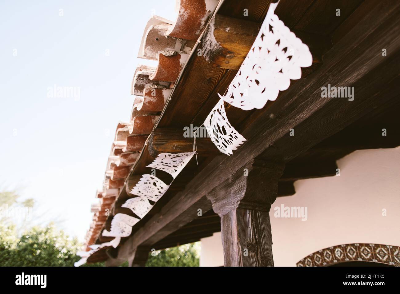 A low angle shot of a wooden patio decorated with traditional paper ...
