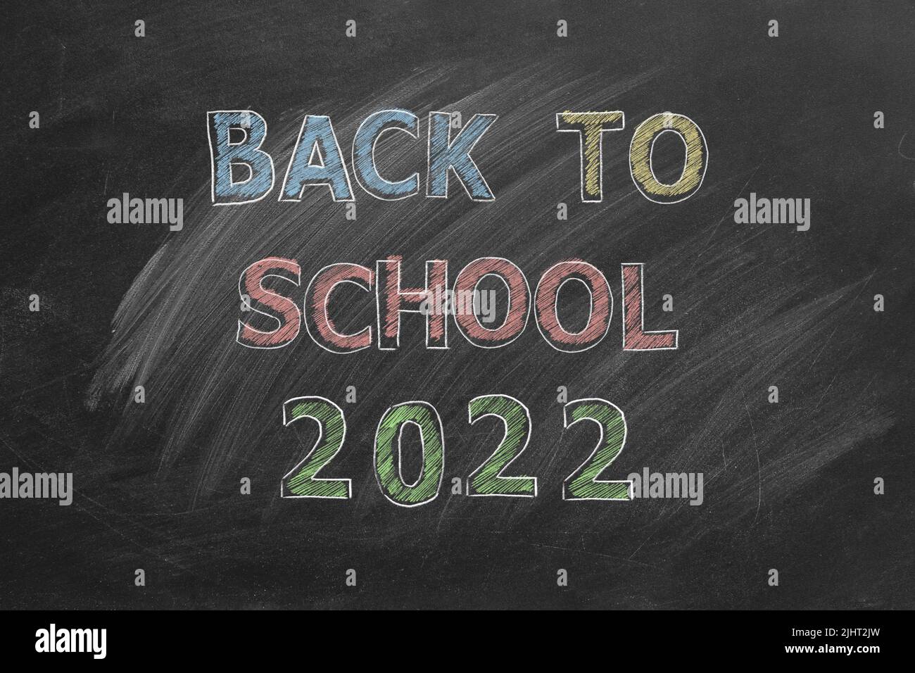 Hand drawn Back to School 2022 text on blackboard Stock Photo - Alamy