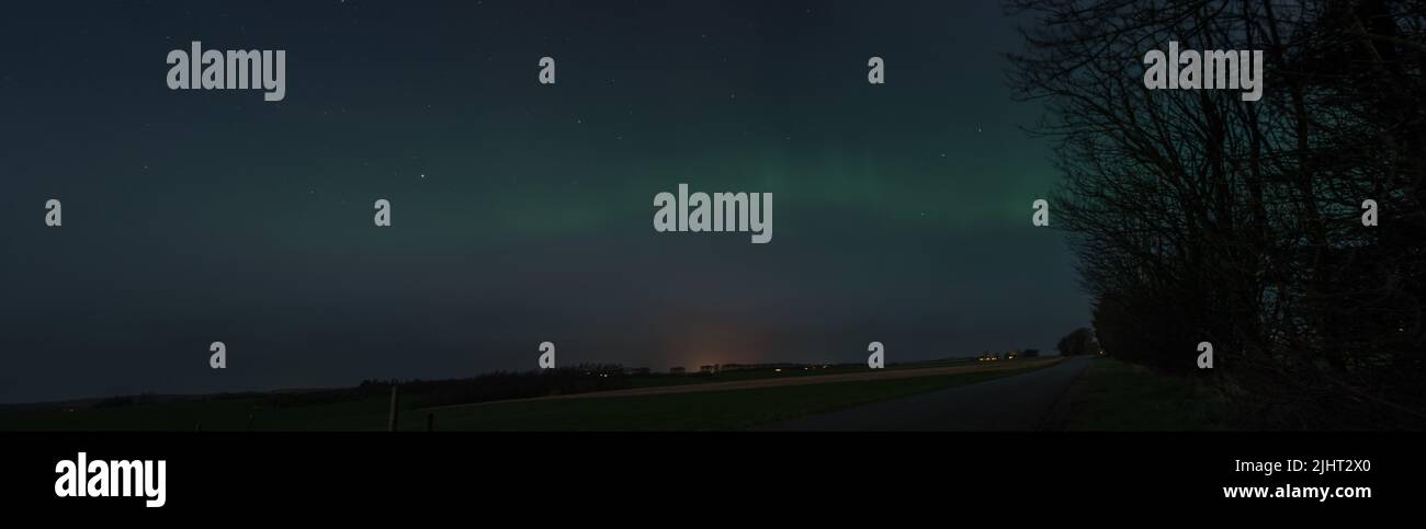 Aurora Borealis dancing in the sky over Thy Denmark Stock Photo - Alamy