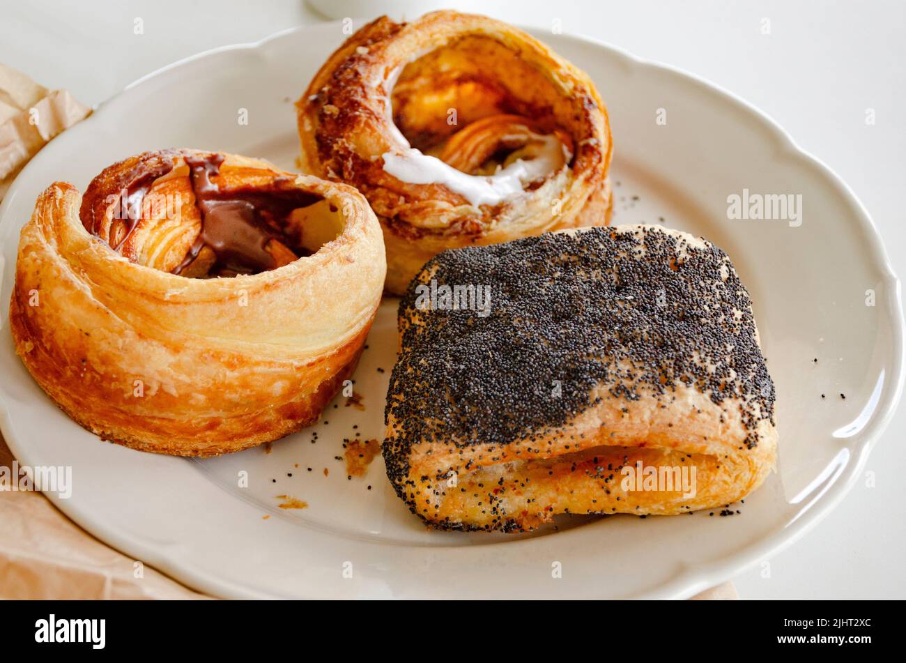 Danish breakfast pastry with cup of coffee Stock Photo - Alamy