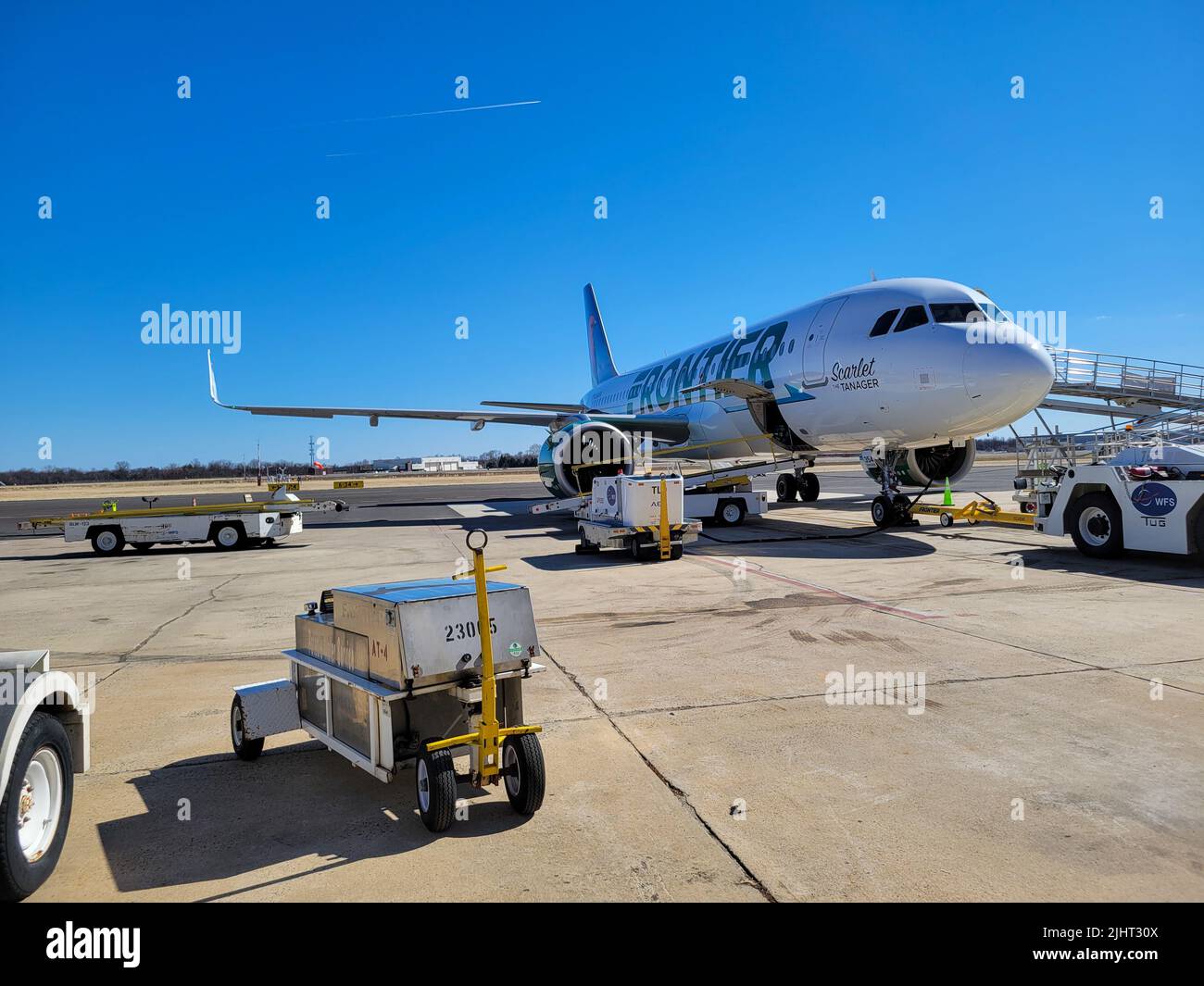A view of plane Airbus A320-251N parked in airport under blue bright ...