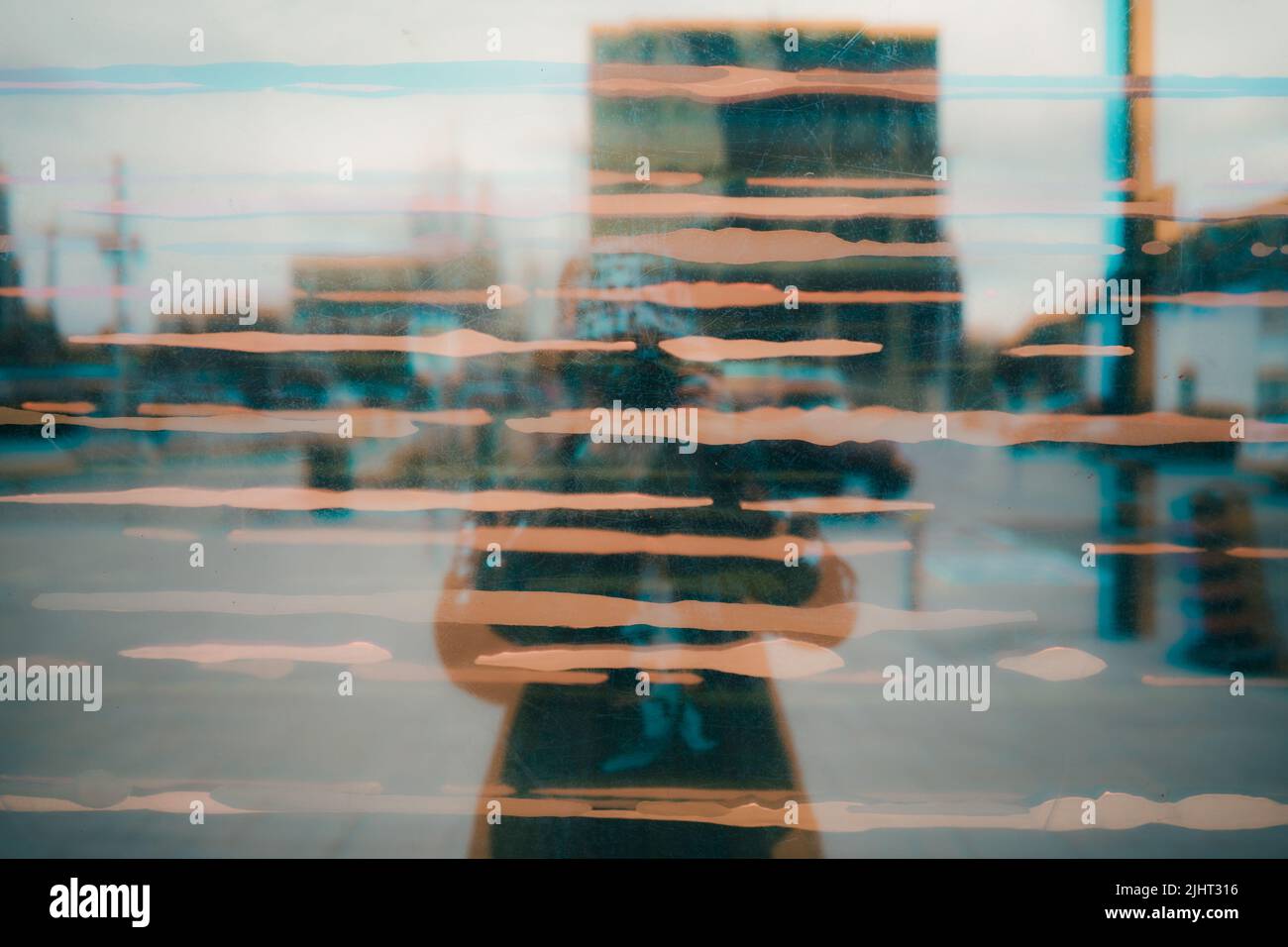 A reflection on glass of photographer taking photo Stock Photo - Alamy