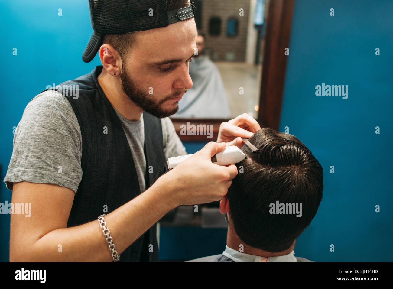 Hair stylist making haircut young hi-res stock photography and images ...