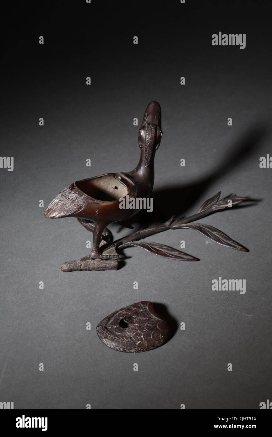 A vertical shot of an ancient Chinese bronze statue Stock Photo - Alamy