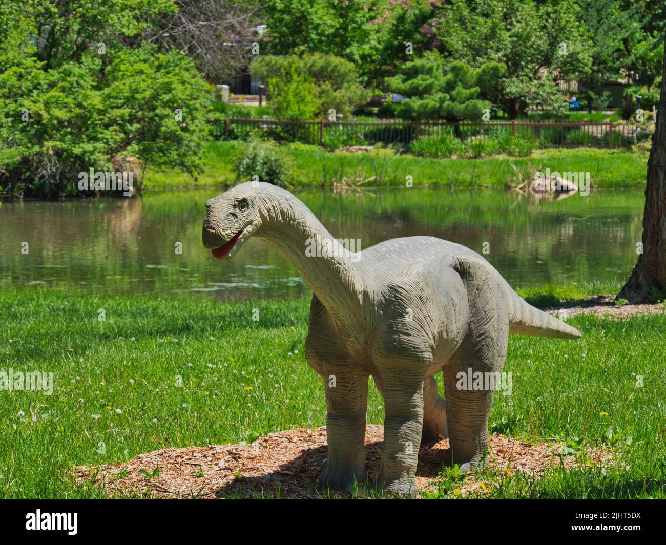 A scenic view of realistic Brontosaurus statue in Topeka Zoo ...