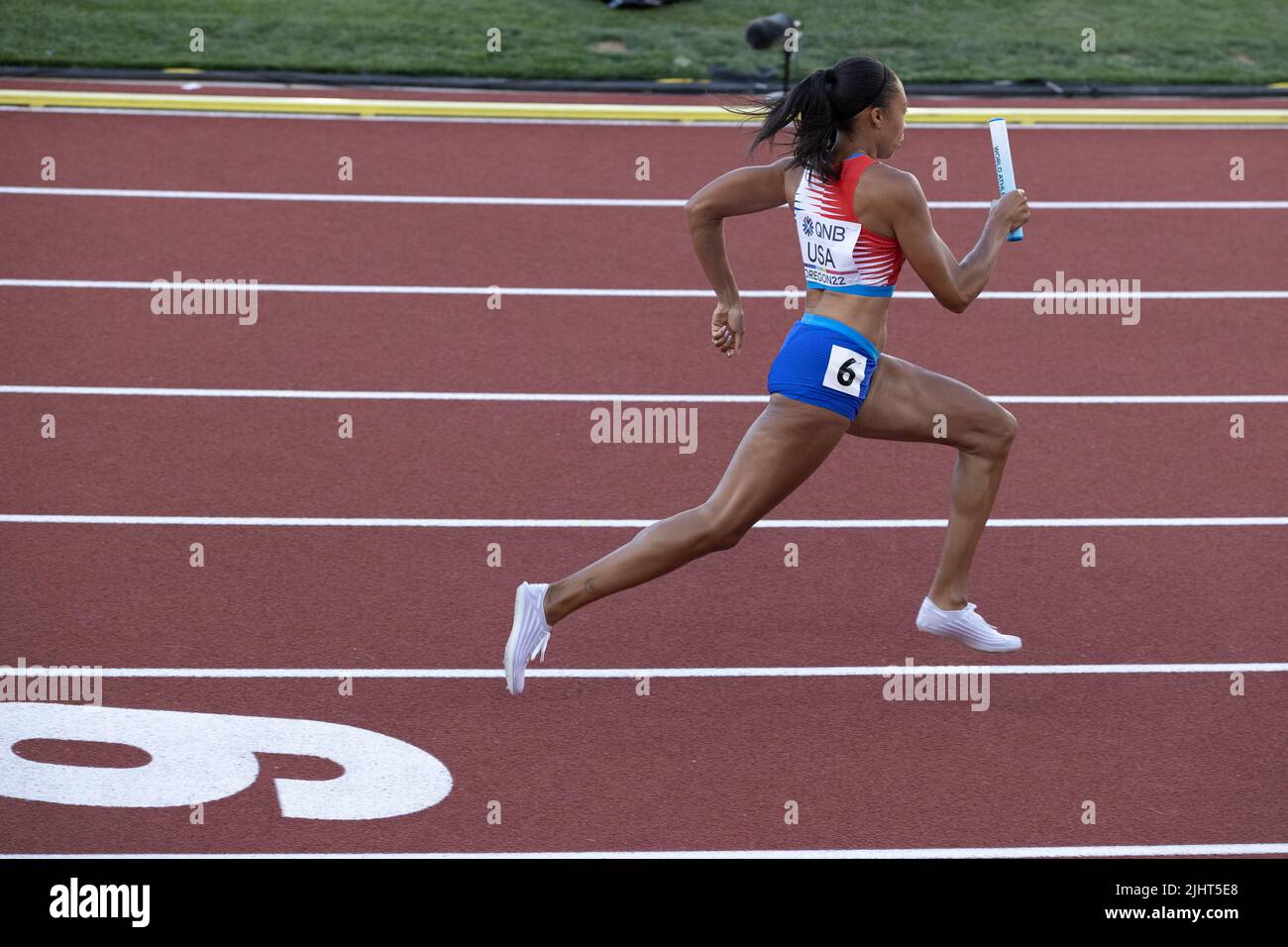 Allyson Felix (USA) takes off on the second leg of the 4 x 400 mixed ...