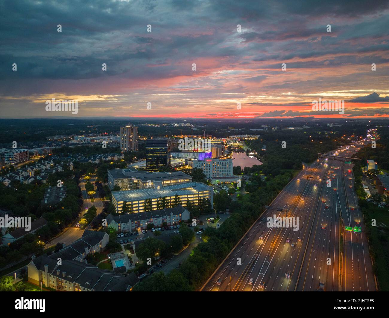 An aerial view of illuminated Gaithersburg cityscape with busy highway ... An aerial view of illuminated Gaithersburg cityscape with busy highway ...
